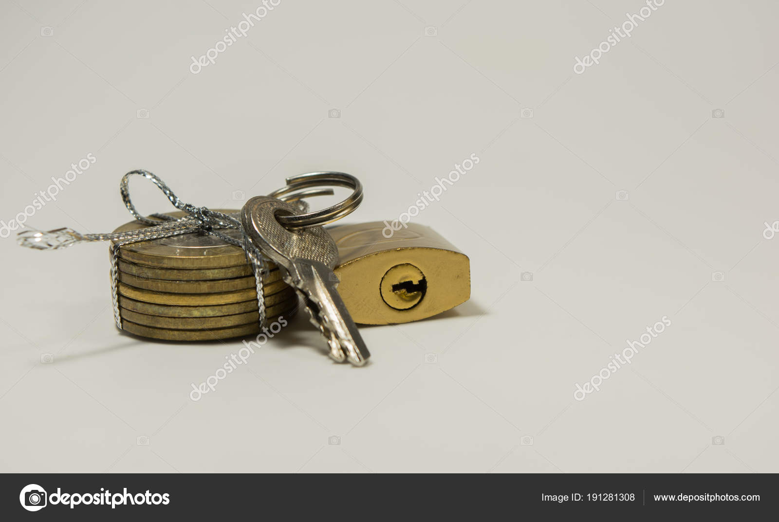 Indian 10 Rupee Coins tied and pad locker with keys on isolated white ...
