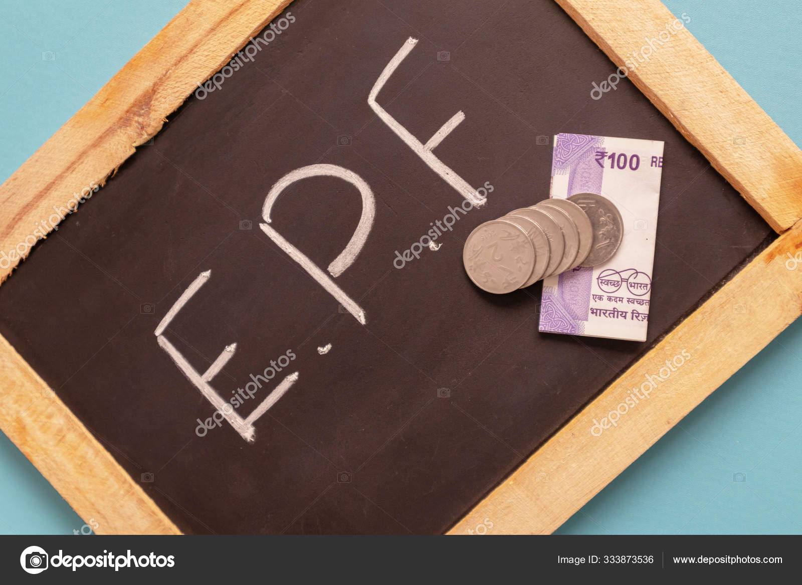 EPF or Employee provident Fund written on black slate with Indian ...