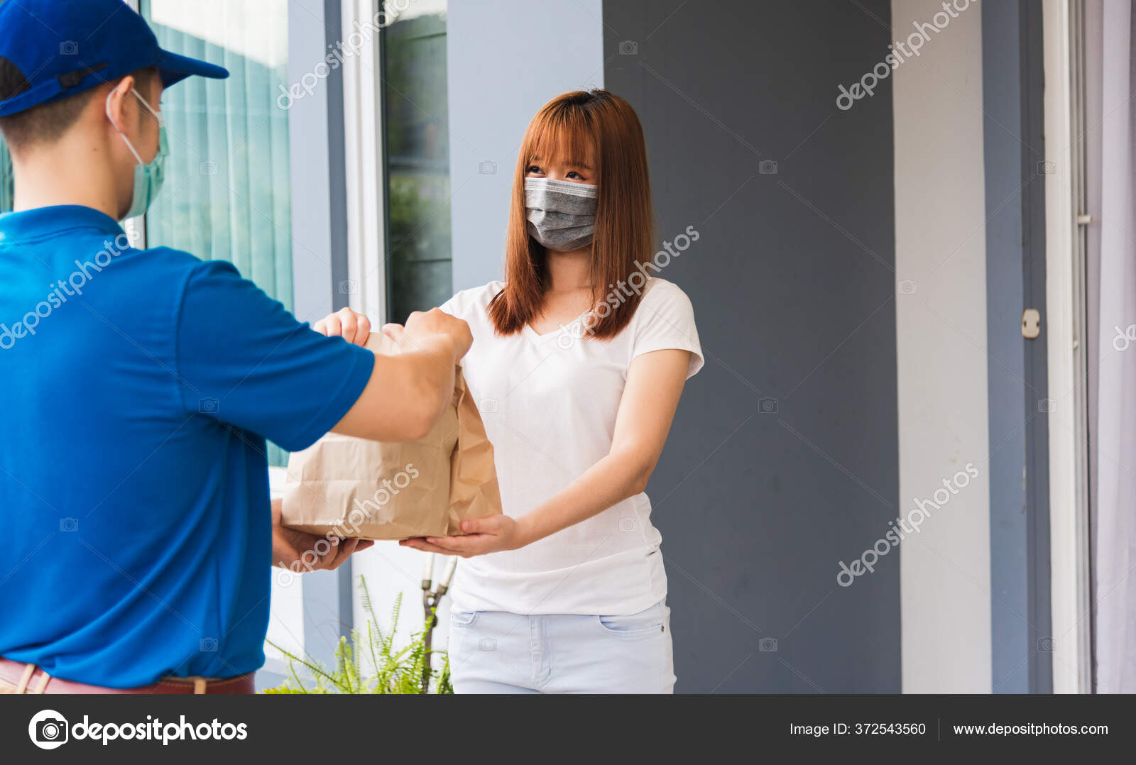 Asian Delivery Express Courier Young Man Giving Paper Bags Fast Stock ...