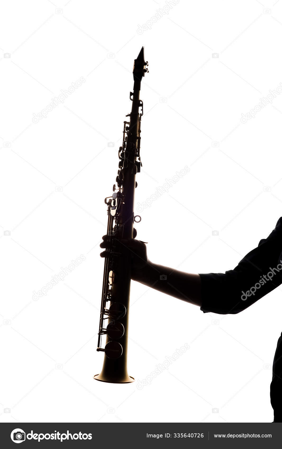 Saxafon on a white background in the hands of a musician silhoue ...