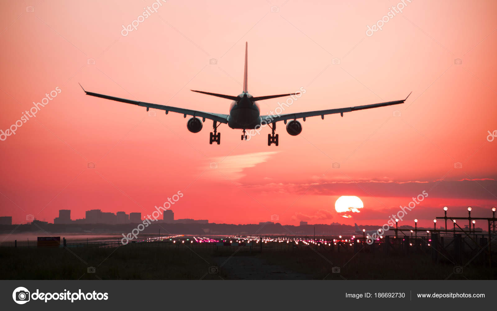 Airplane Flying In Sunset