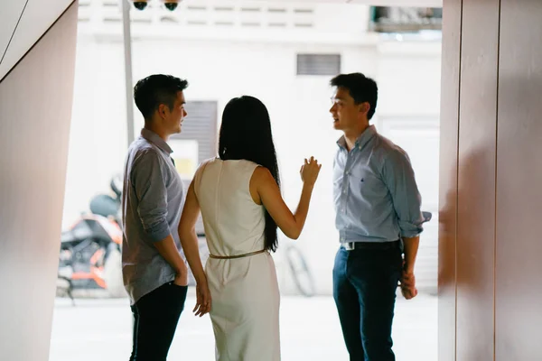 team of three business professionals (lawyers, bankers or accountants ...