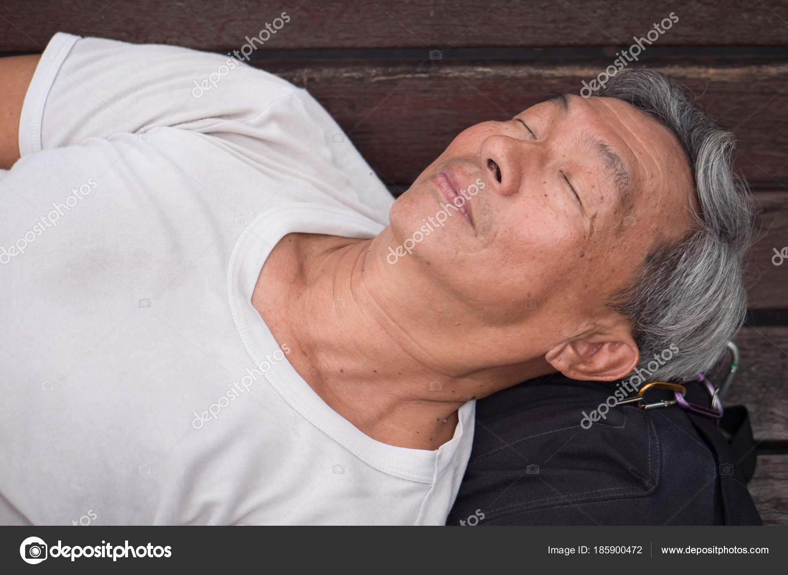 Old senior poor homeless man sleeping outdoor, urban poverty concept ...