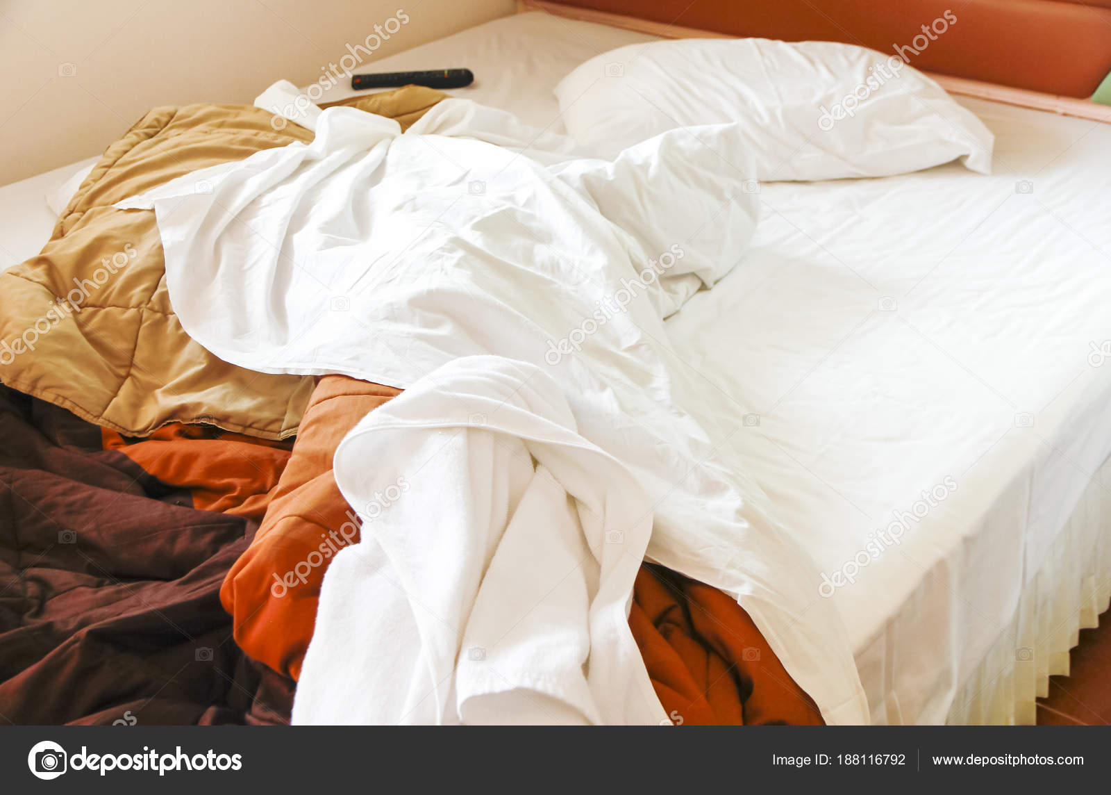 Messy bed after wake up in the morning. Stock Photo by ©singkamc 188116792