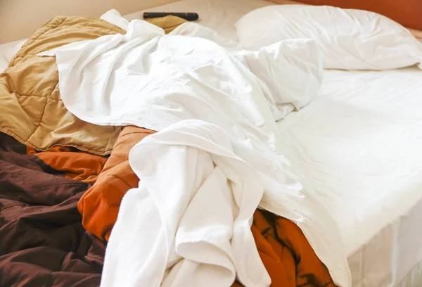 Messy bed after wake up in the morning. Stock Photo by ©singkamc 188116792
