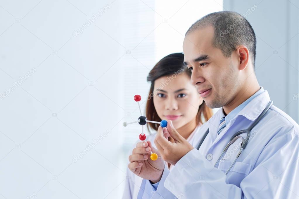 Researchers examining molecular structure — Stock Photo © DragonImages ... Researchers examining molecular structure — Stock Photo © DragonImages ...