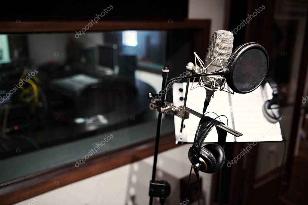 Modern microphone in recording studio — Stock Photo © DragonImages ...