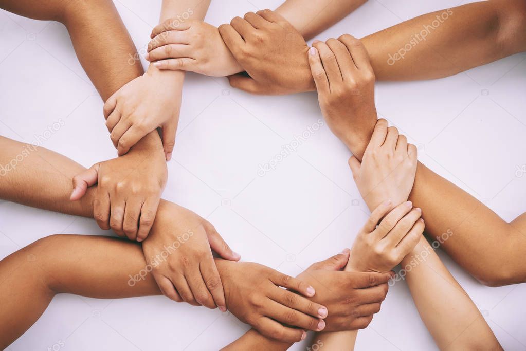 Hands of people holding wrists Stock Photo by ©DragonImages 129210492