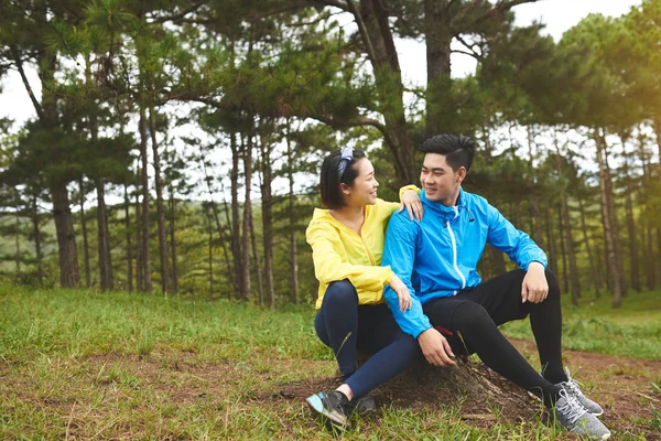 couple discussing outdoor training in forest - Stock Image - Everypixel