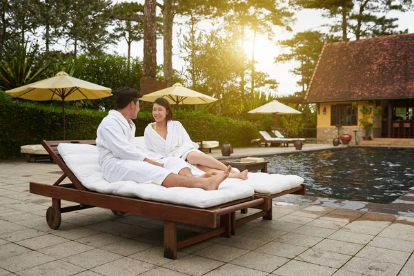 Couple sitting on balcony — Stock Photo © DragonImages #132543658