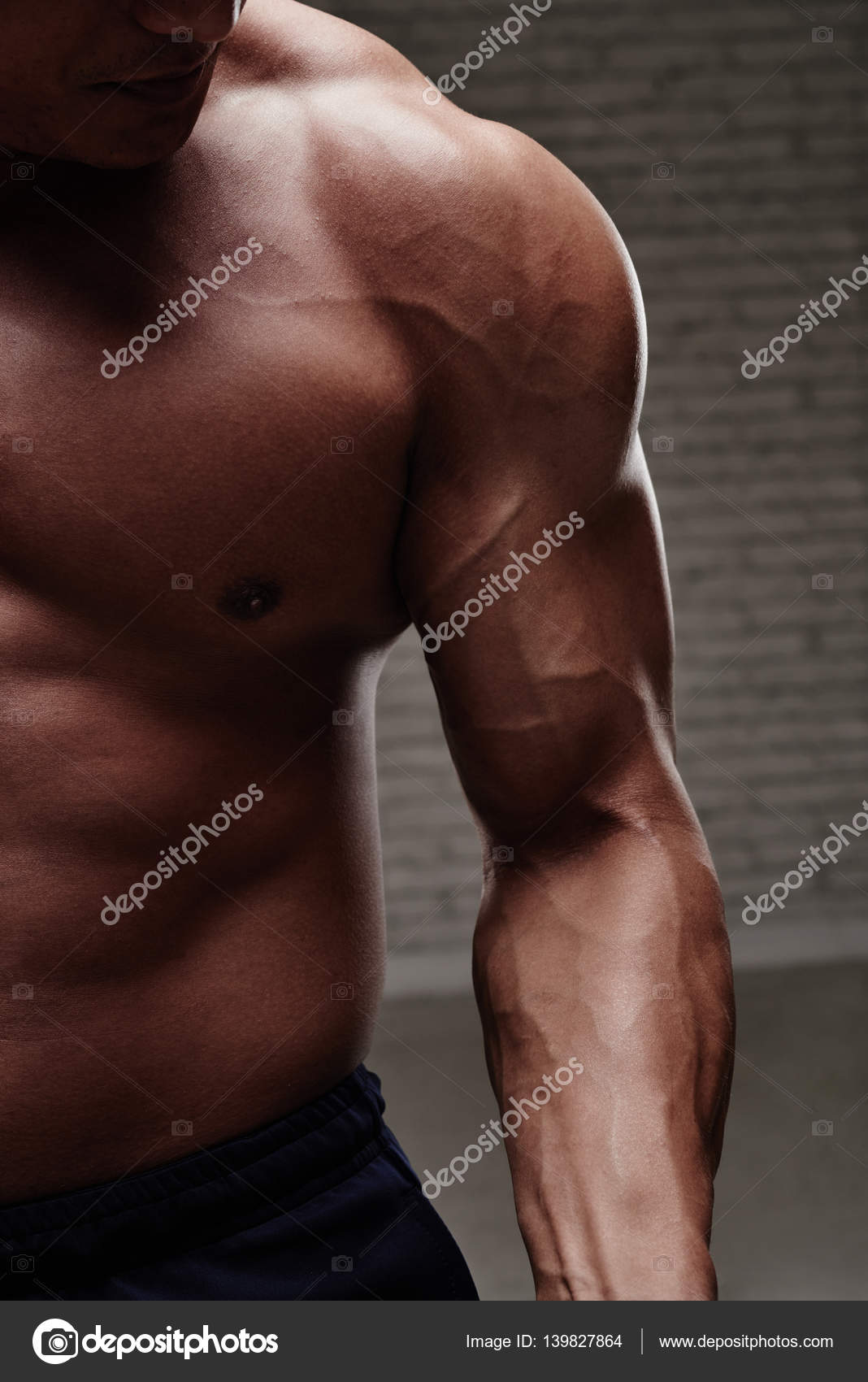 Muscular man with strong arms — Stock Photo © DragonImages #139827864