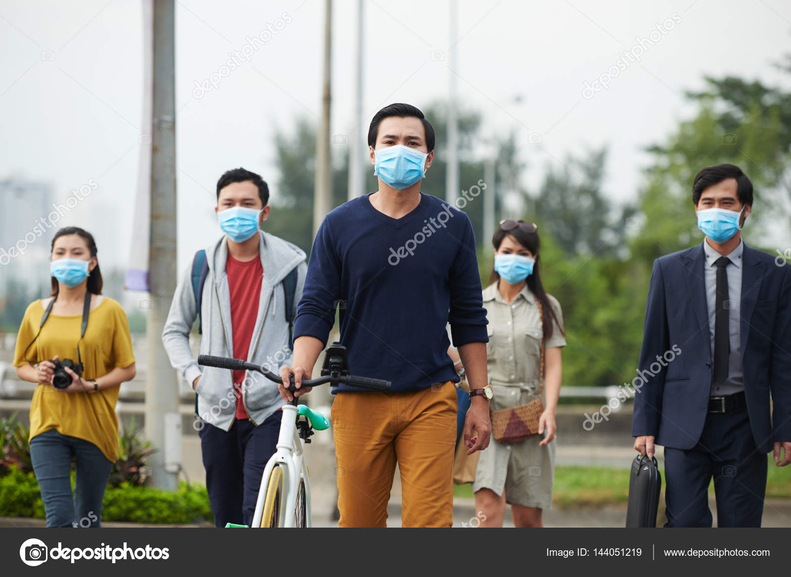Passers-by with masks Stock Photo by ©DragonImages 144051219