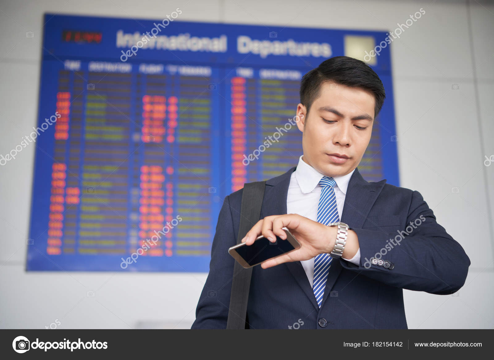 Asian Businessman Checking Time Wristwatch While Waiting His Flight ...