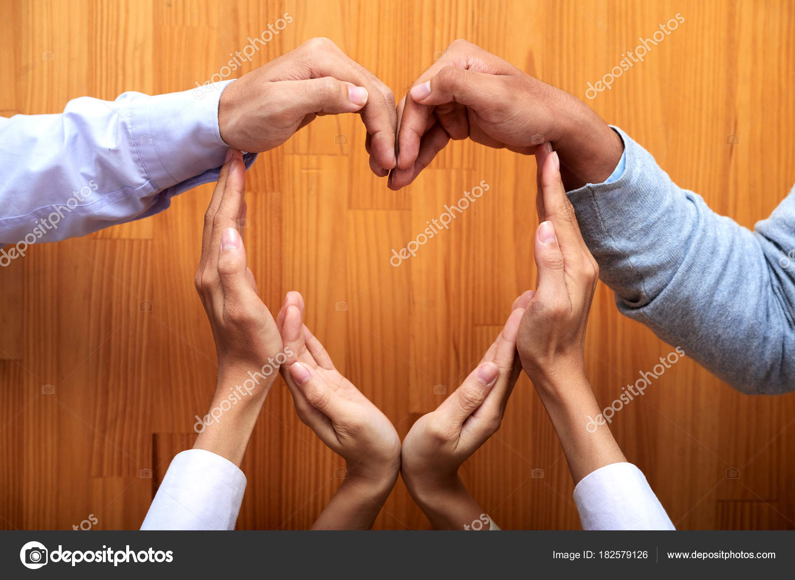 Two People Making A Heart With Their Hands