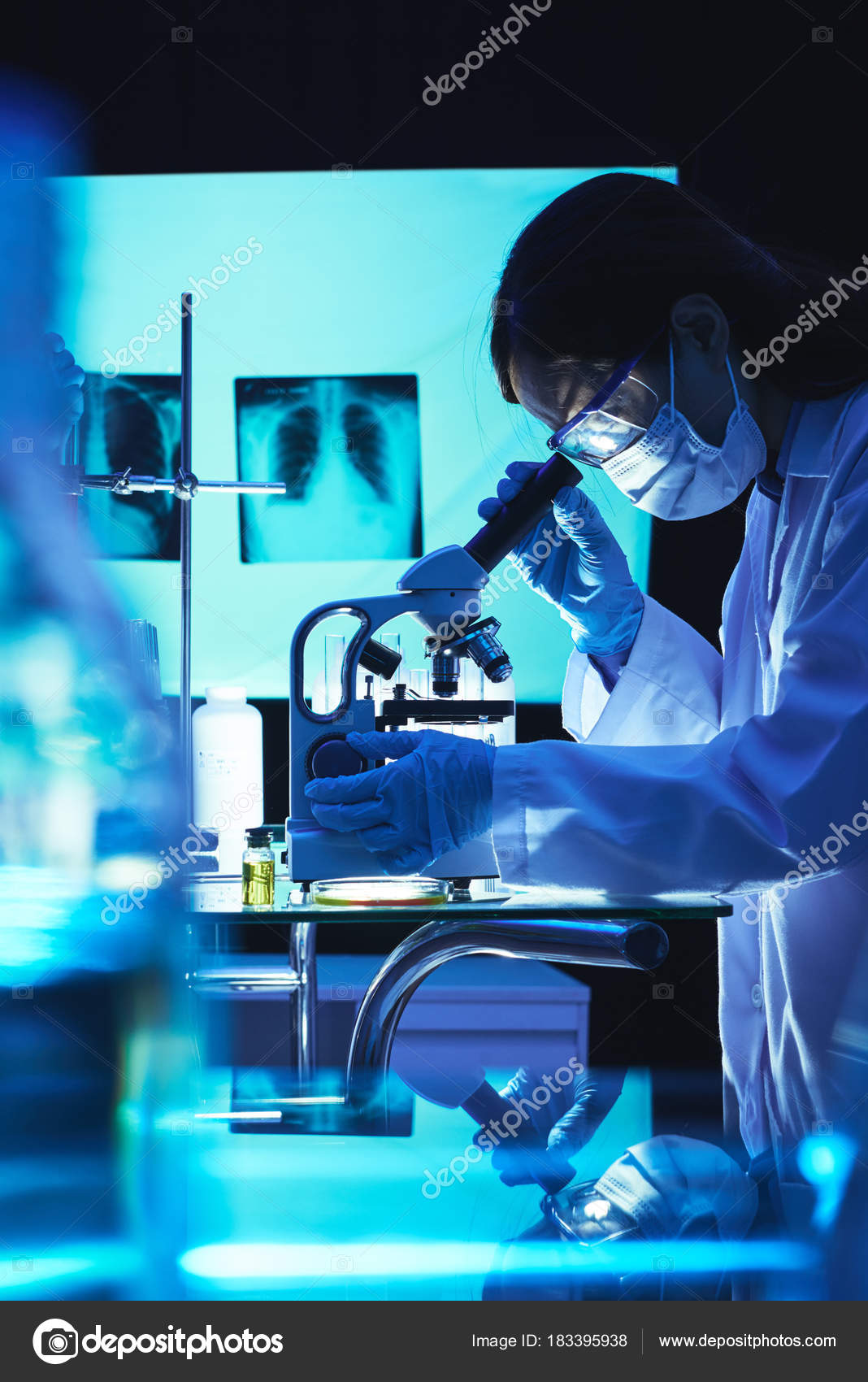 Professional Female Microbiologist Using Microscope Laboratory Stock ...