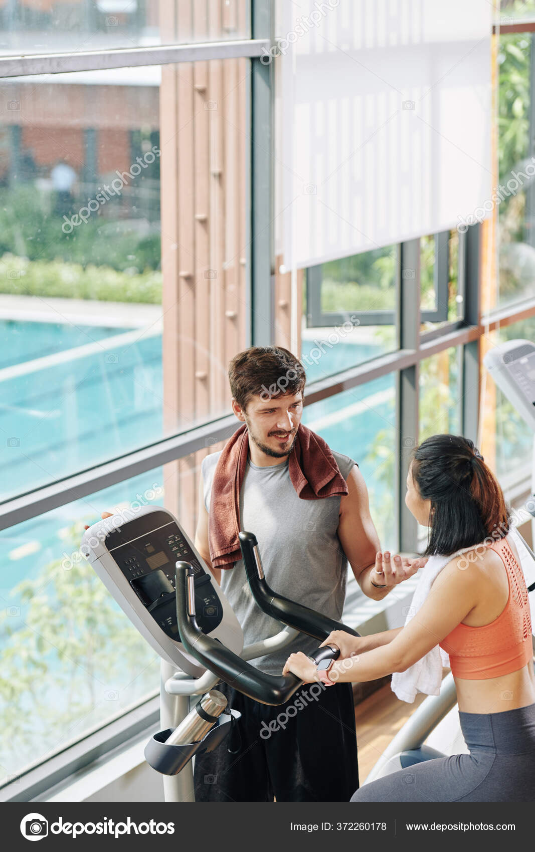 Smiling Fitness Coach Talking Client Explaining Importance Warming ...
