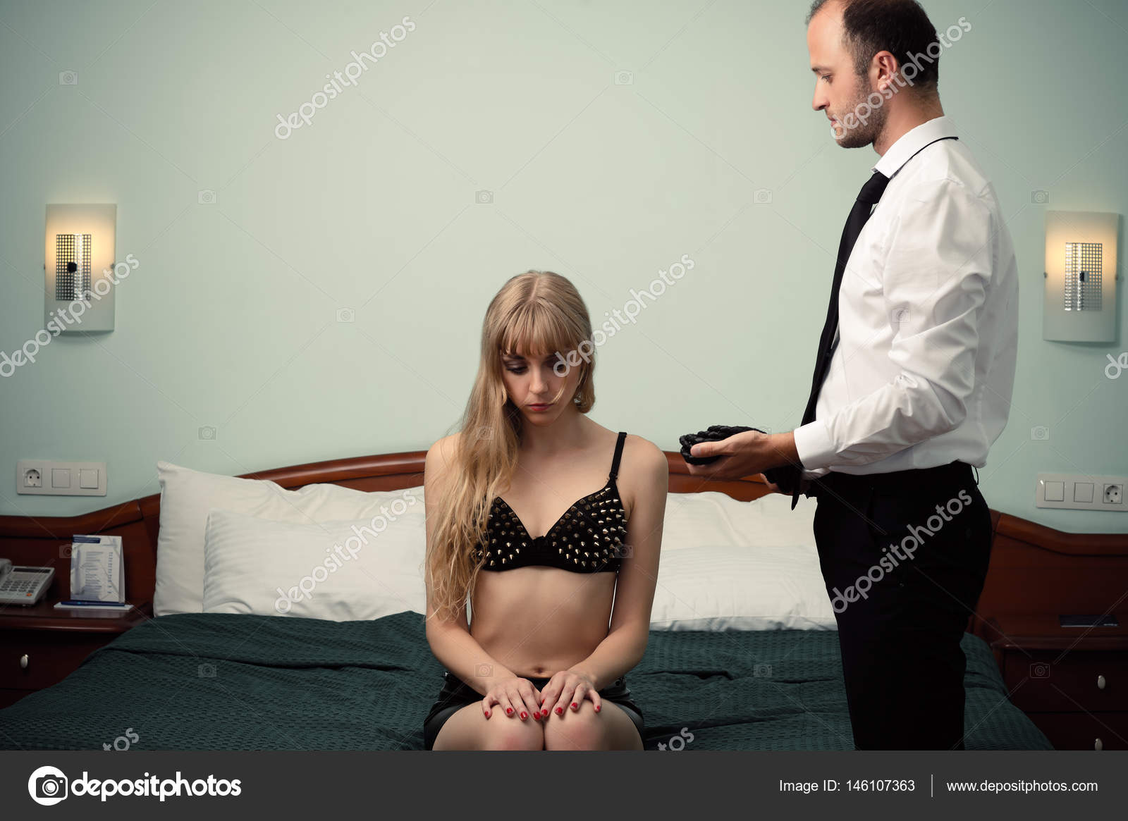 Woman Whipping Man In Stocks