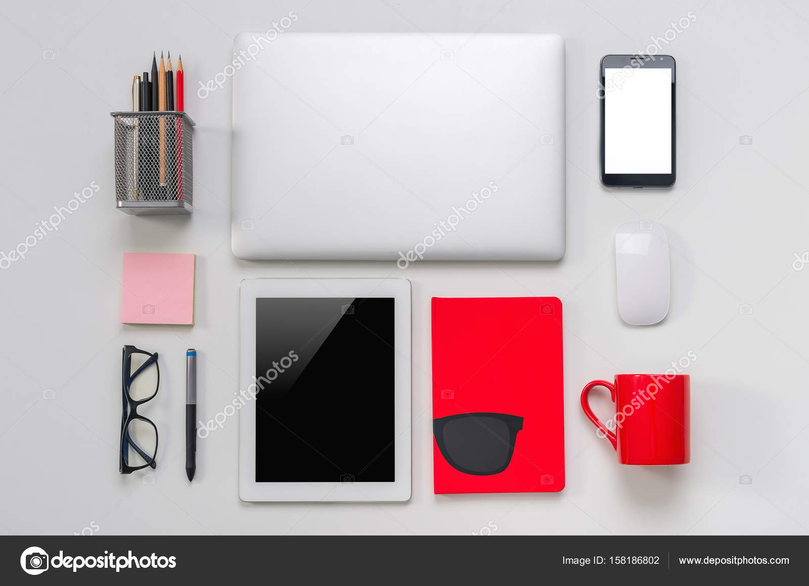 Desk with office equipment Stock Photo by ©nirutdps 158186802