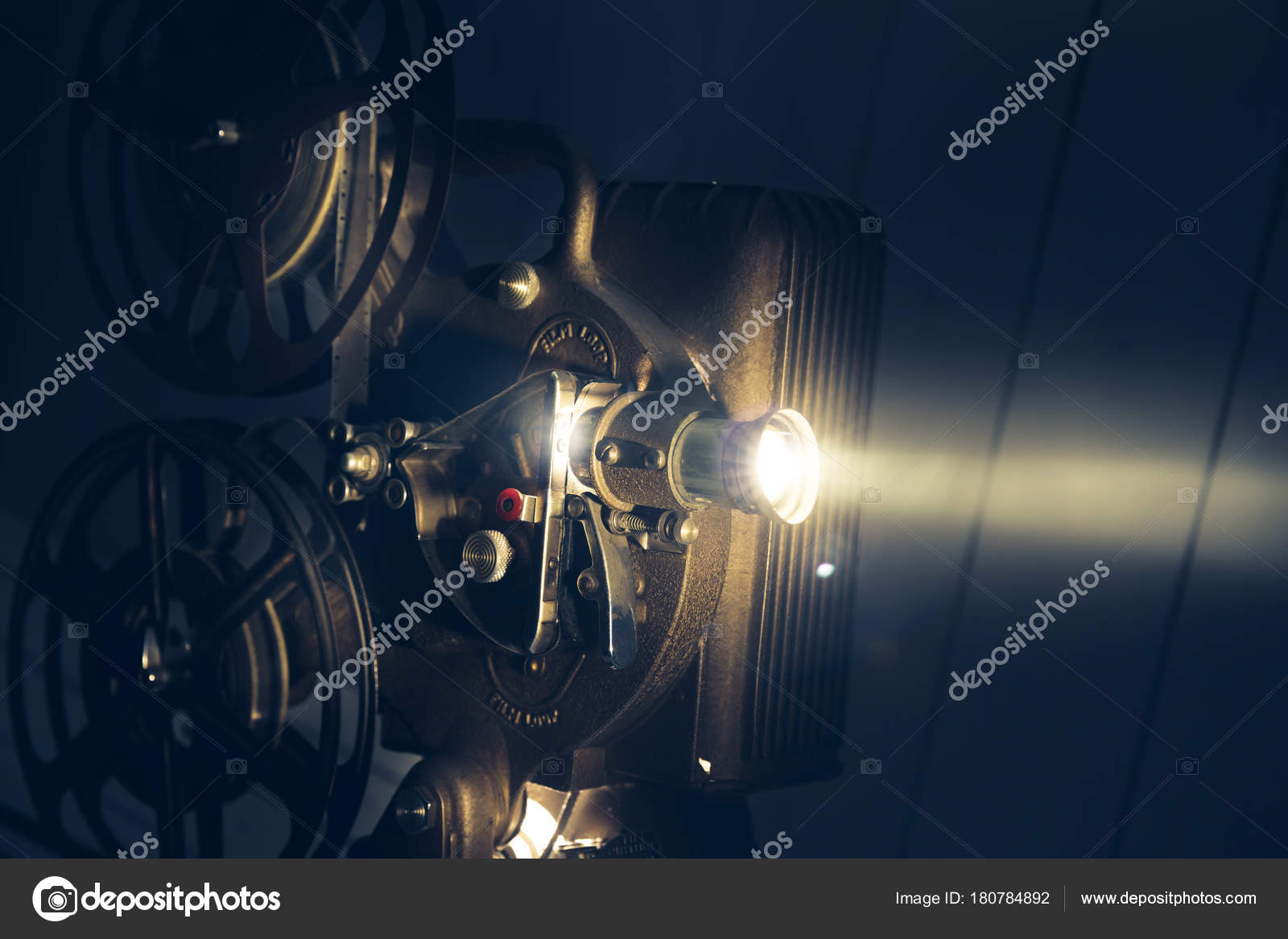 Film projector with dramatic lighting Stock Photo by ©fergregory 180784892