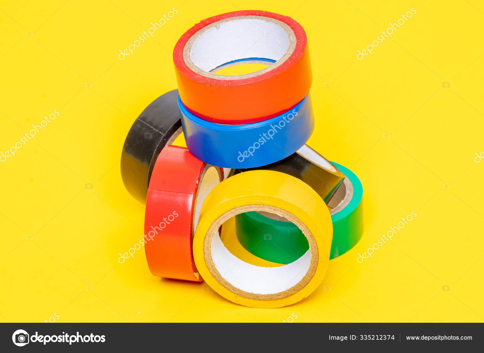 Electrical tapes isolated. Close-up of a set of colorful rolls o ...