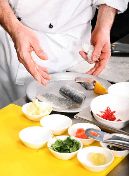 Chef preparing fish - Stock Image - Everypixel