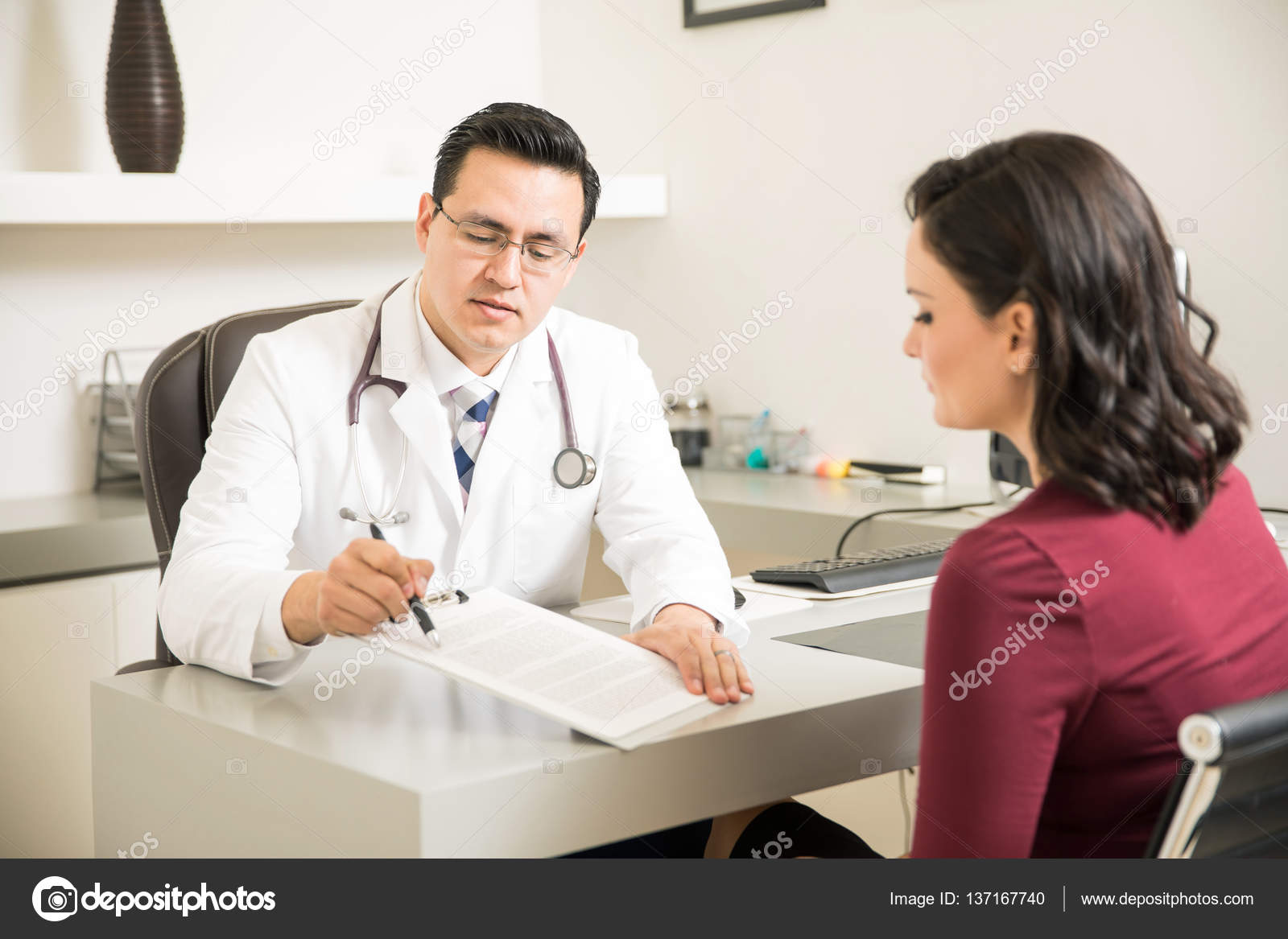 Doctor explaining to patient Stock Photo by ©tonodiaz 137167740