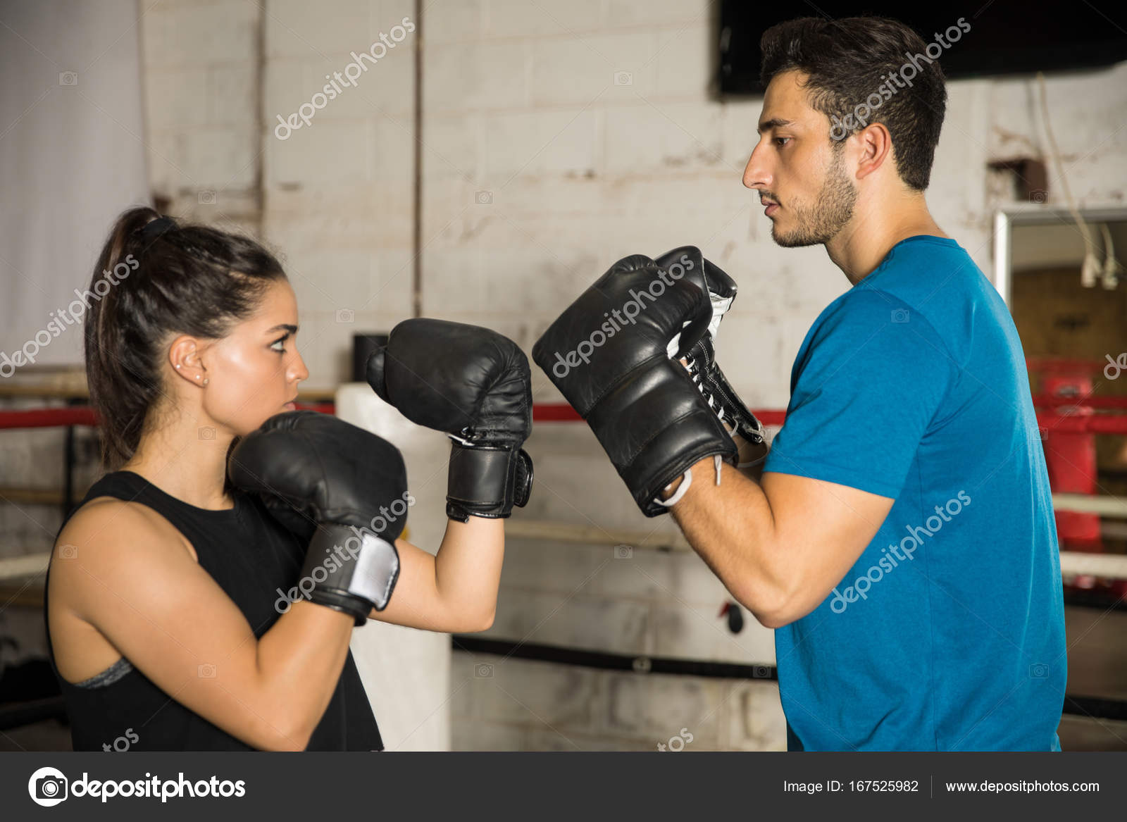 Couple fighting in a boxing ring Stock Photo by ©tonodiaz 167525982