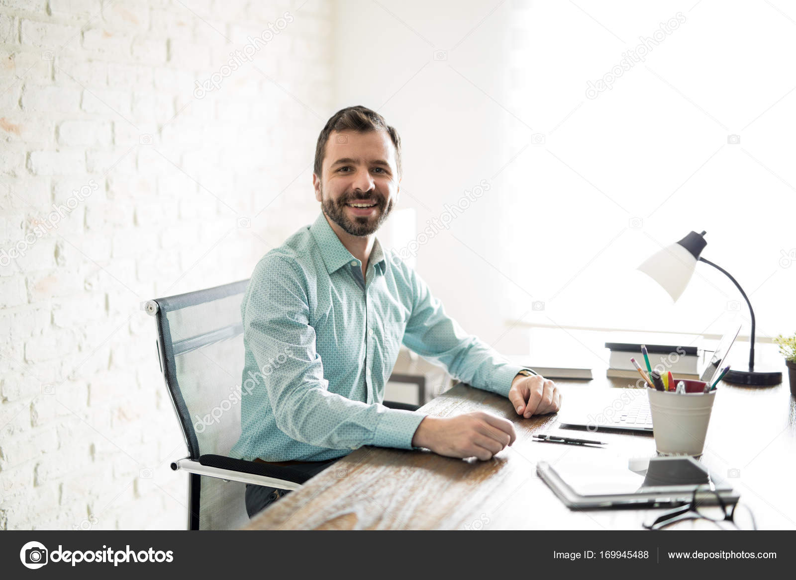 Hispanic worker at the office — Stock Photo © tonodiaz #169945488