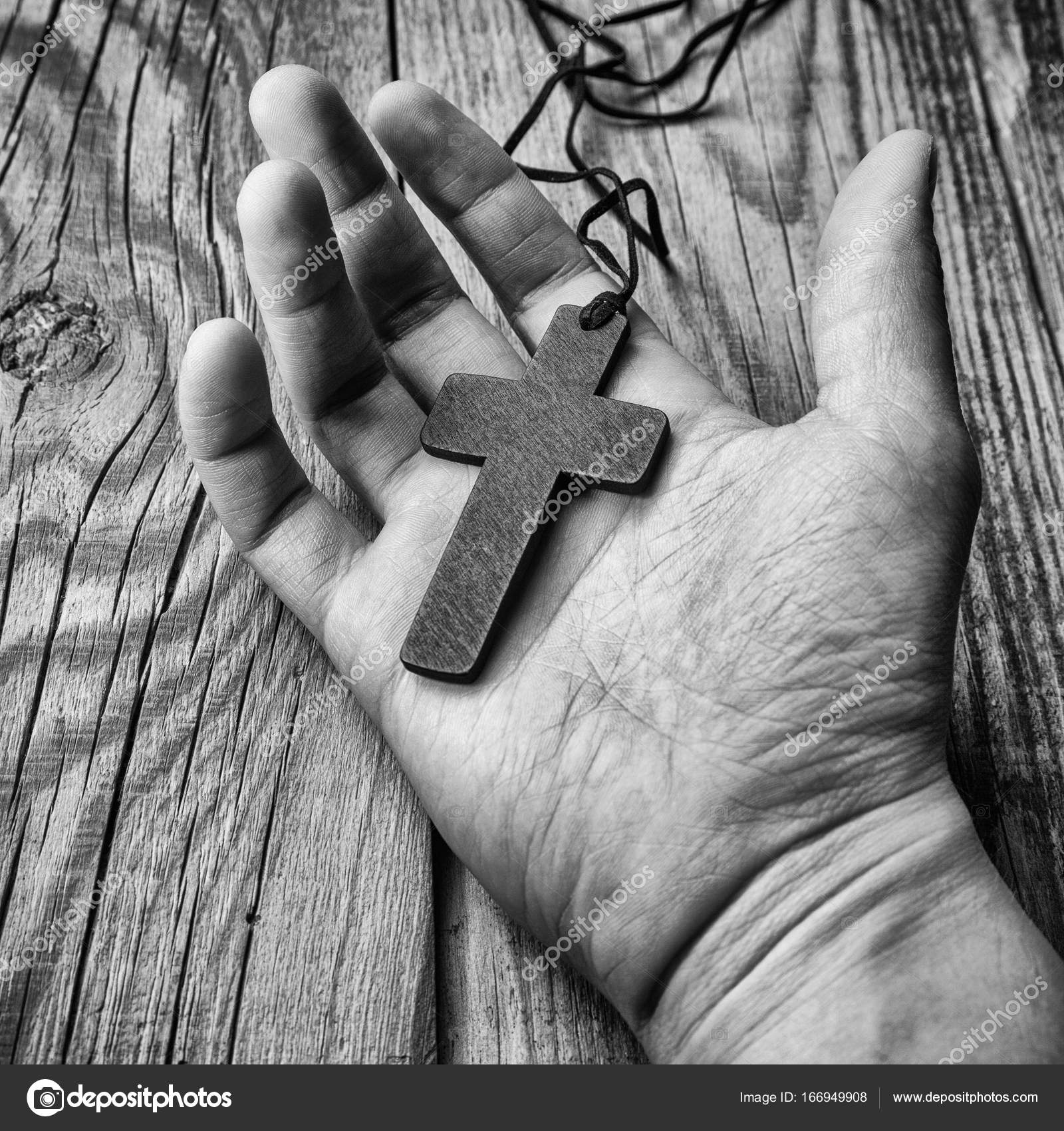Cross in hand on background Stock Photo by ©merrydolla 166949908