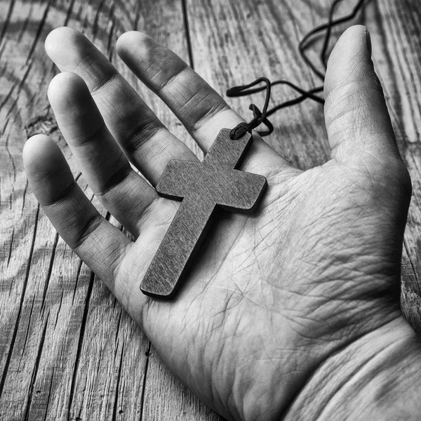 Cross in hand on background Stock Photo by ©merrydolla 166949908
