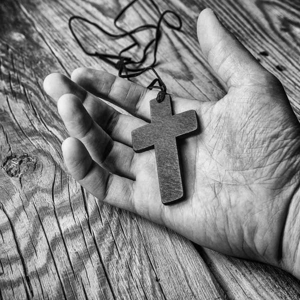 Cross in hand on background Stock Photo by ©merrydolla 166949908