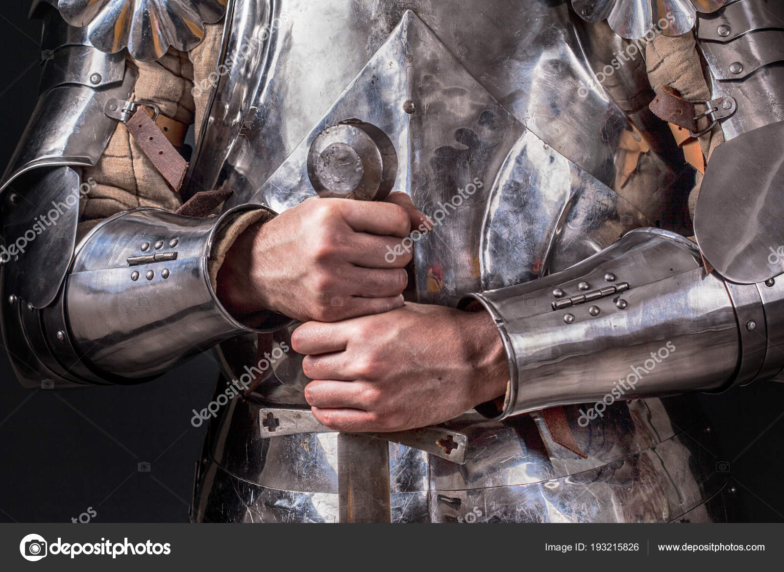 Gloved Hand Holding Sword