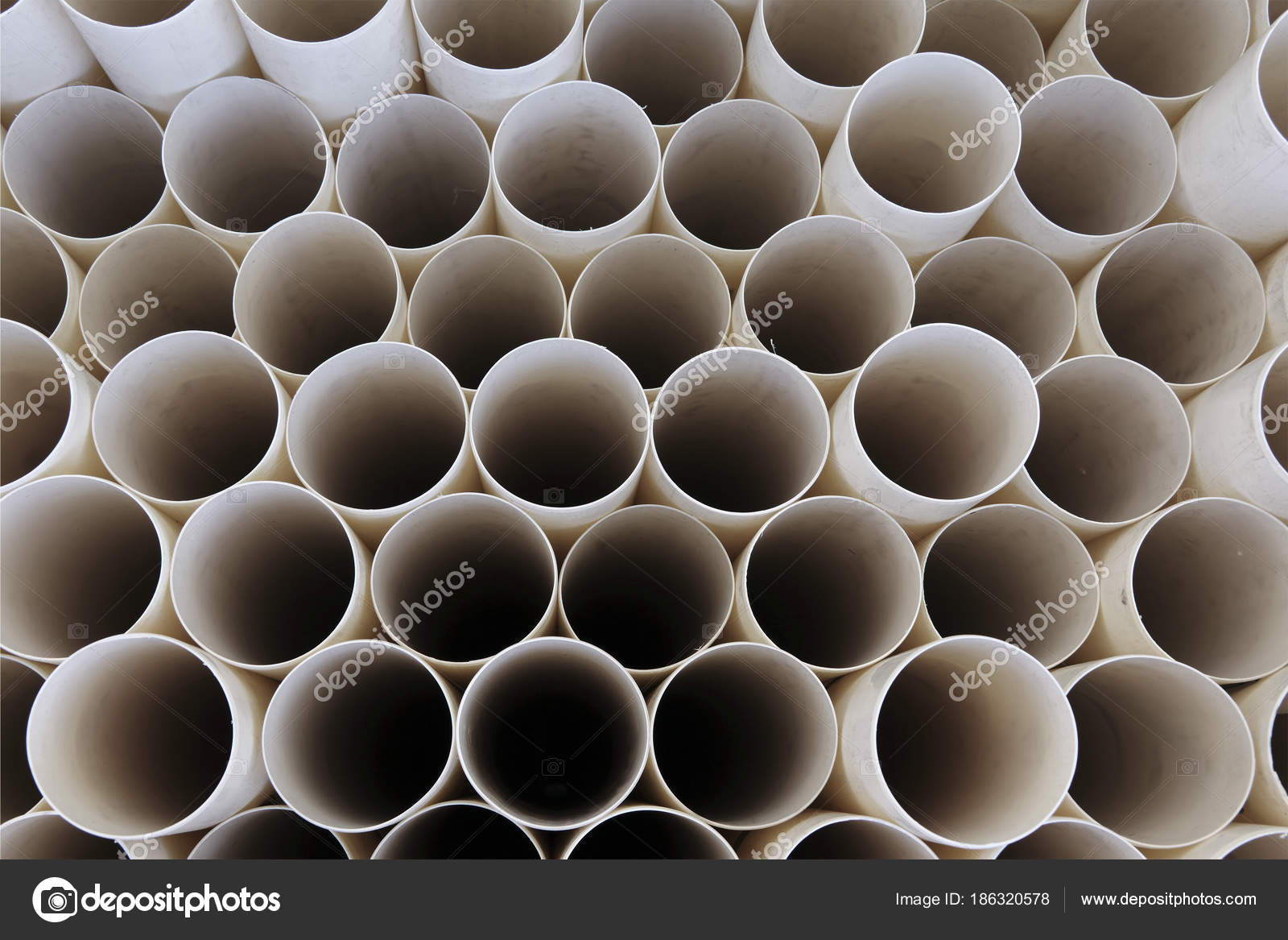 Close View Stacked Pvc Pipes Stock Photo by ©rocharibeiro 186320578