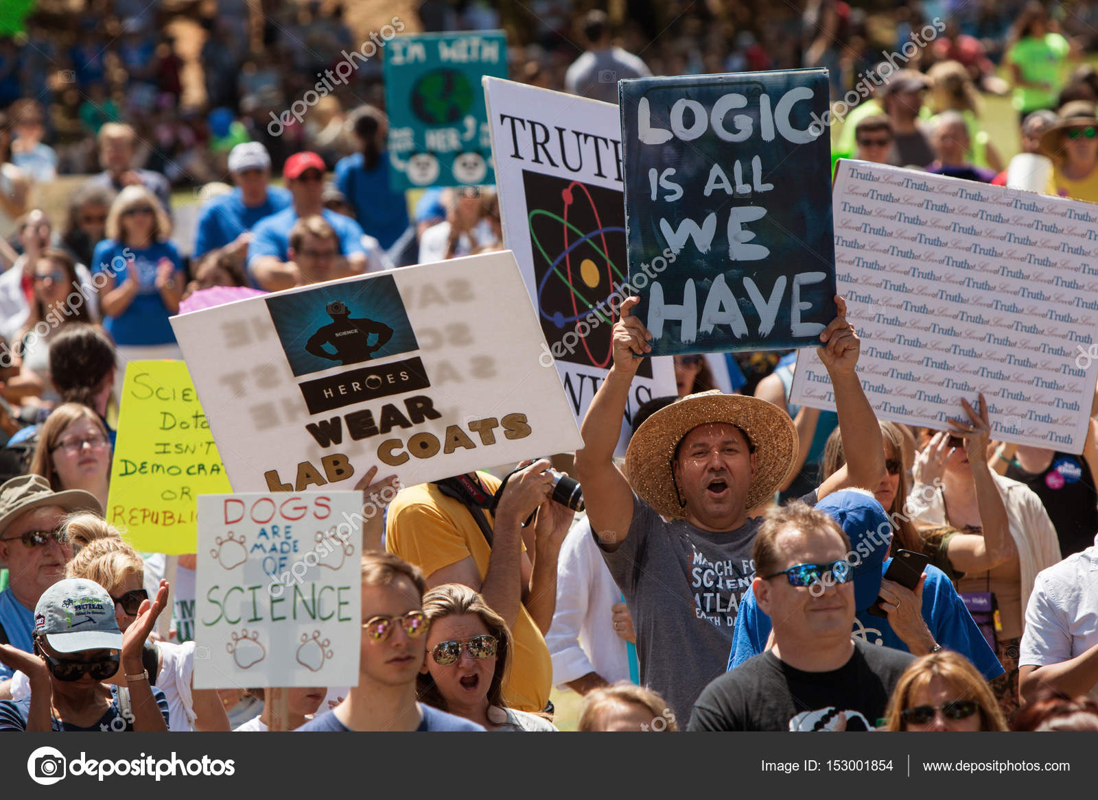 Marchers Display Signs At Rally Before Atlanta March For Science ...