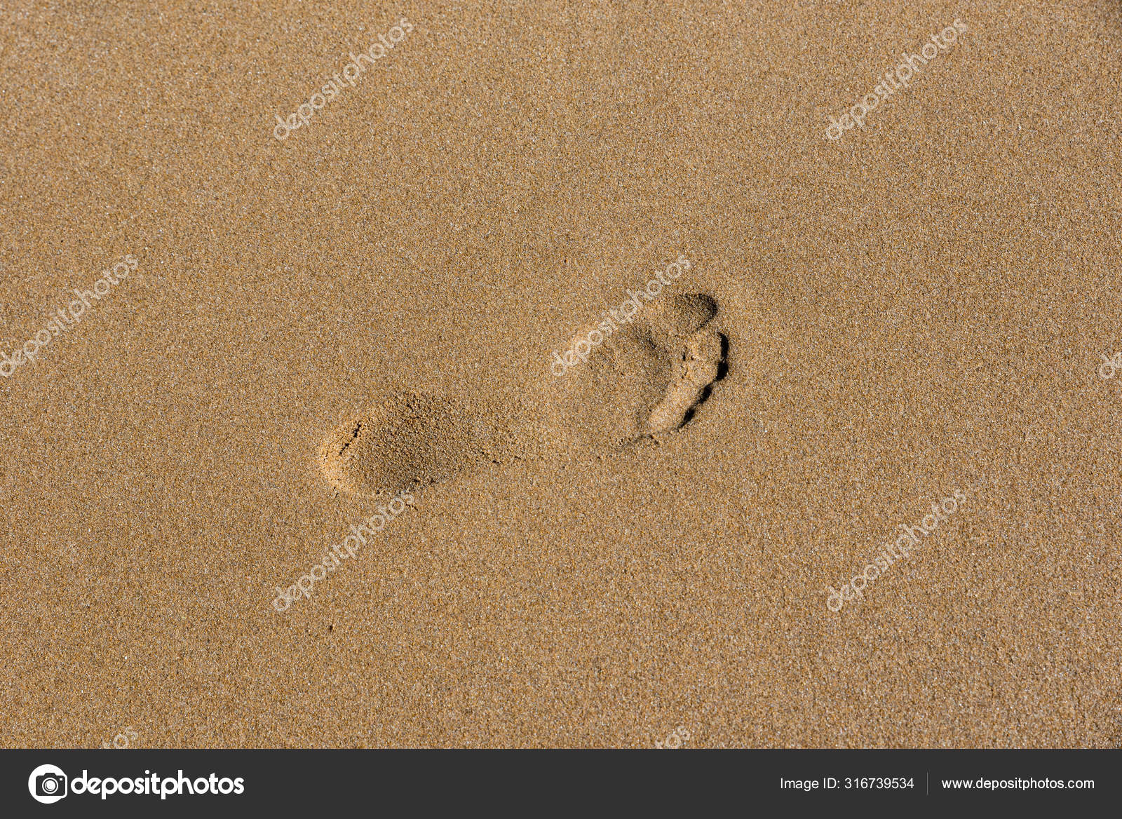 Footprints on the shore of the sea — Stock Photo © fpwing_c #316739534