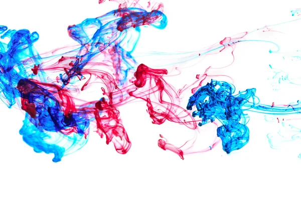 Red and green ink in water — Stock Photo © Shtanzman #127668092