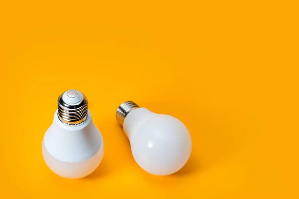 LED, New technology light bulb on yellow background, Energy super ...
