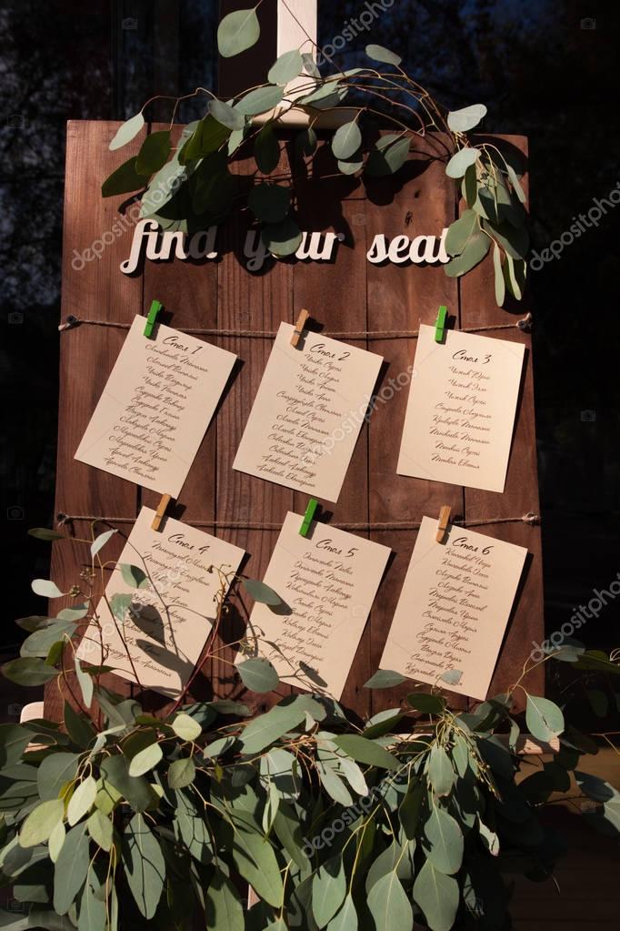 Easel with the seating chart Stock Photo by ©alusa92 129245746