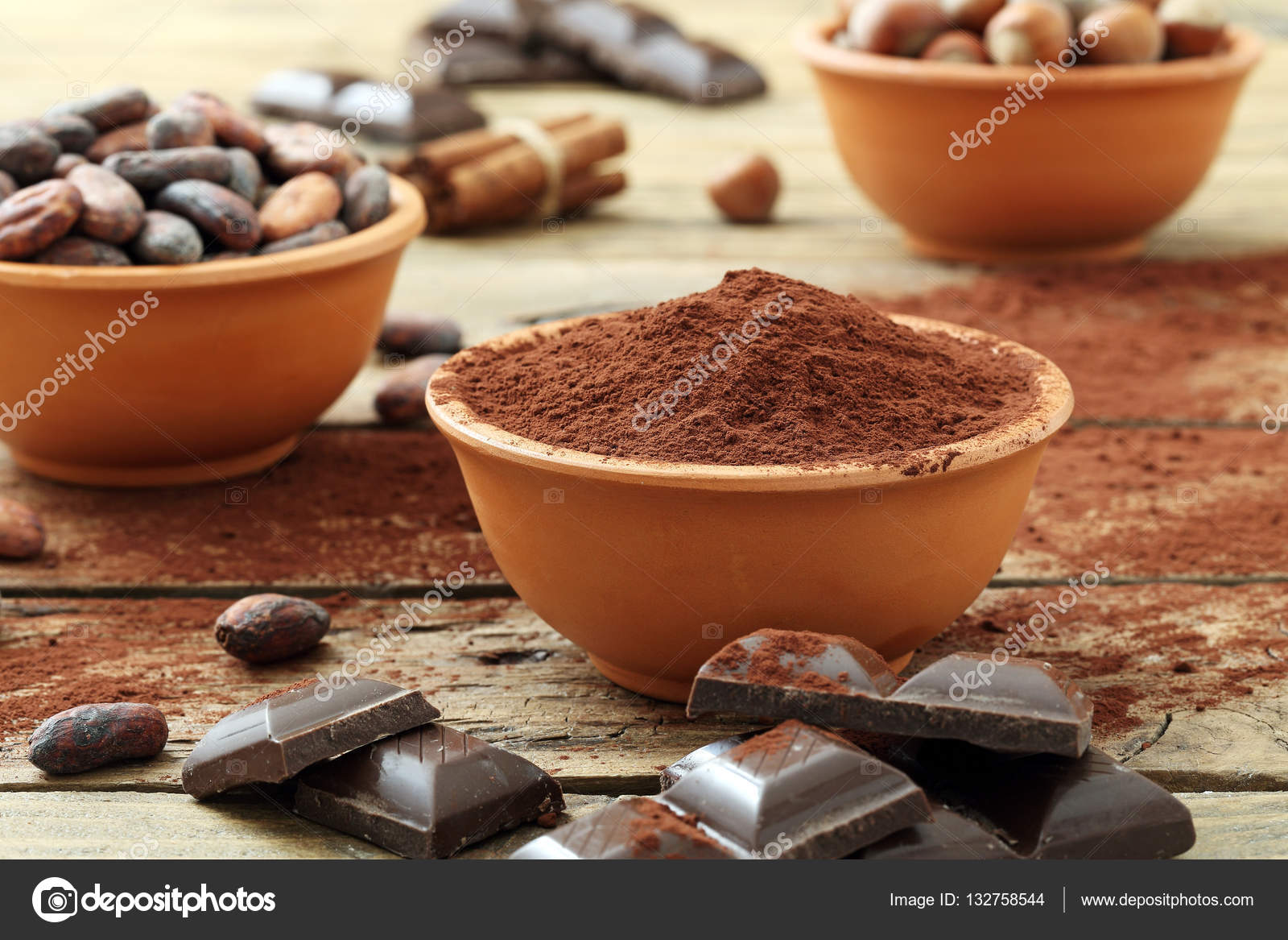 Cocoa beans, powder, hazelnuts and chocolate — Stock Photo © denio109 ...