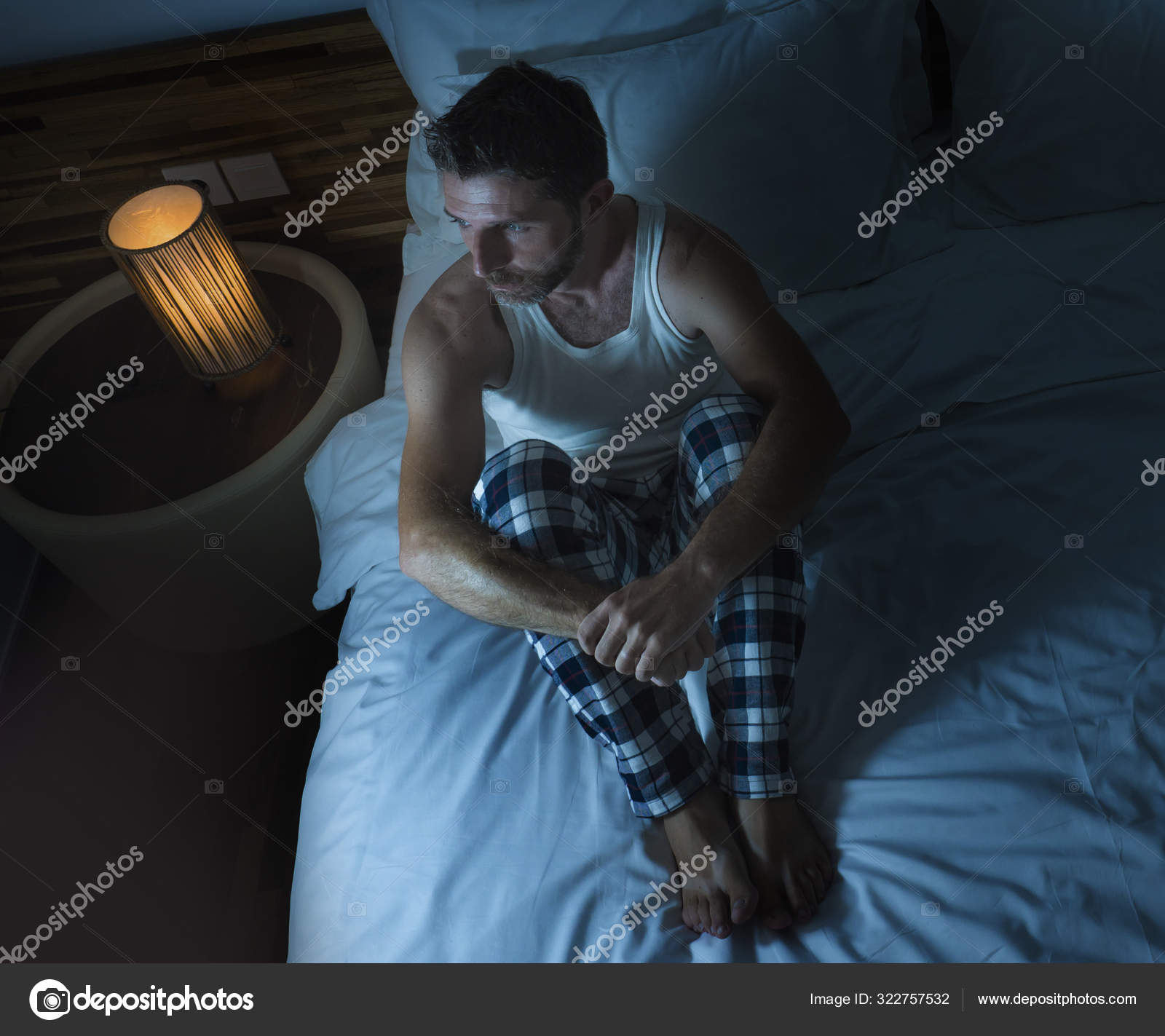 Dramatic lifestyle portrait of young attractive sad and depressed man ...