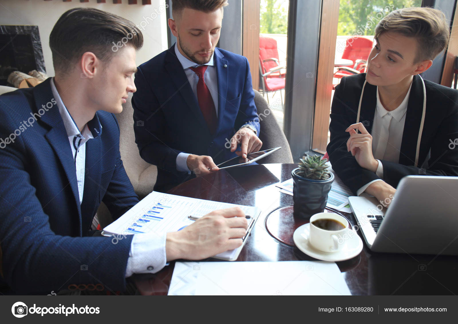 Business person analyzing financial statistics displayed on the tablet ... Business person analyzing financial statistics displayed on the tablet ...