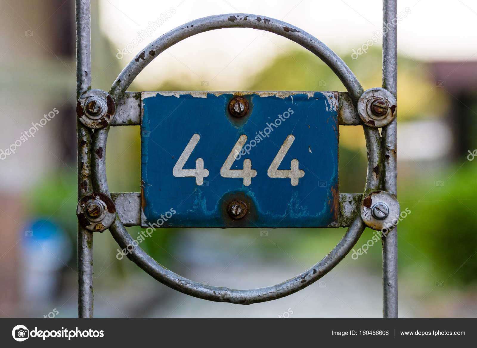 Plate with numbers 444 on the old fence. — Stock Photo © S_Kohl #160456608