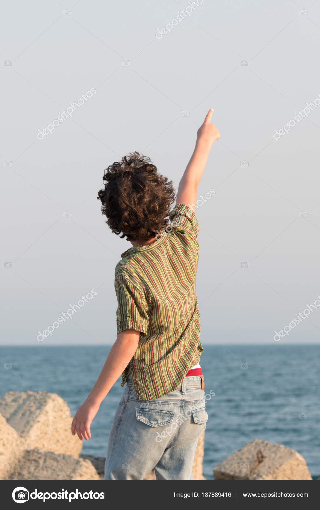 Boy Standing Pier Facing Sea Pointing His Hand Sky Stock Photo by ©S ...