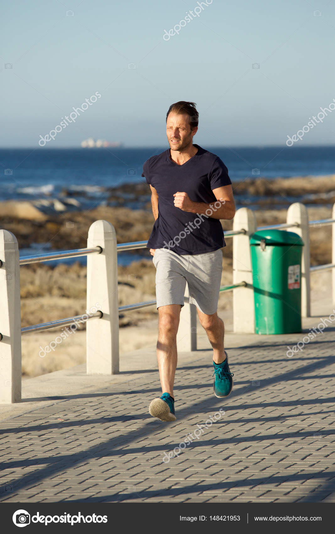 Sports man running Stock Photo by ©mimagephotos 148421953