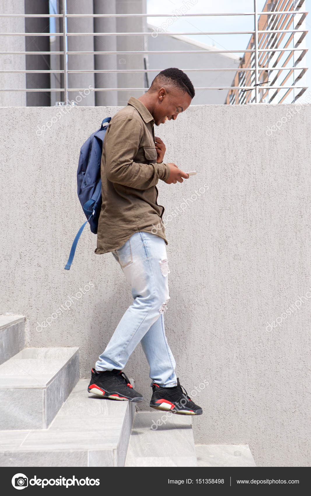 Man walking down stairs Stock Photo by ©mimagephotos 151358498