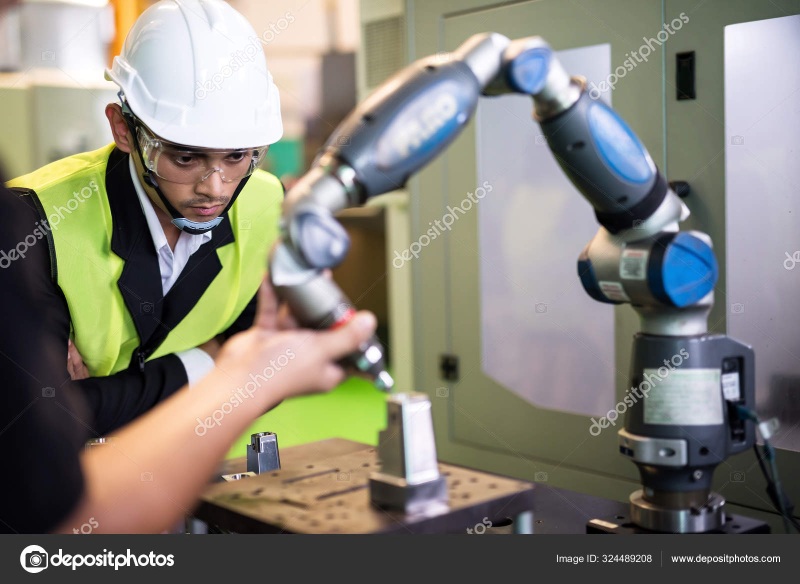 Factory manager check robot lathe machine hand Stock Photo by ...