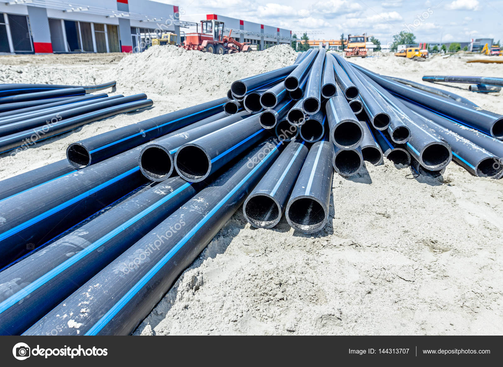 Distributed plastic pipes are stacked, piled temporarily at buil ...