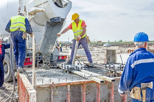 Pouring reinforced concrete in foundation mold – Stock Editorial Photo ...