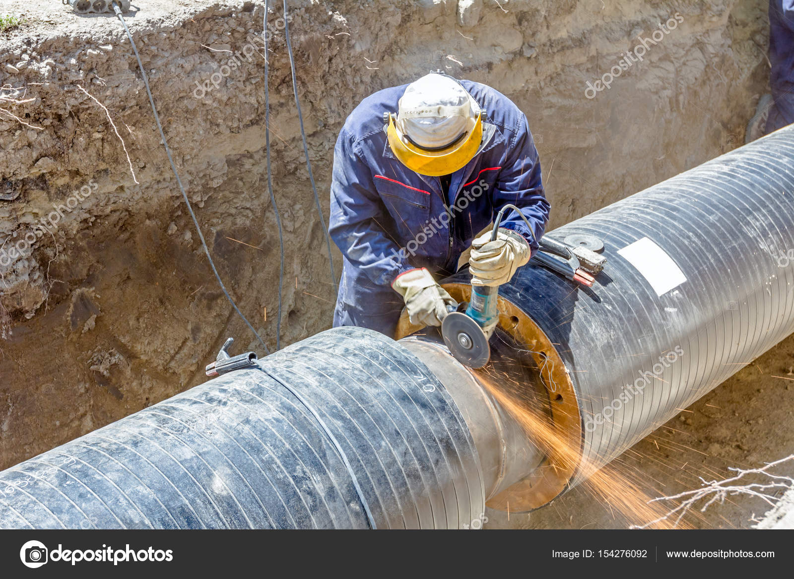 Worker is cleaning weld with a abrasive machine, grinder Stock Photo by ...