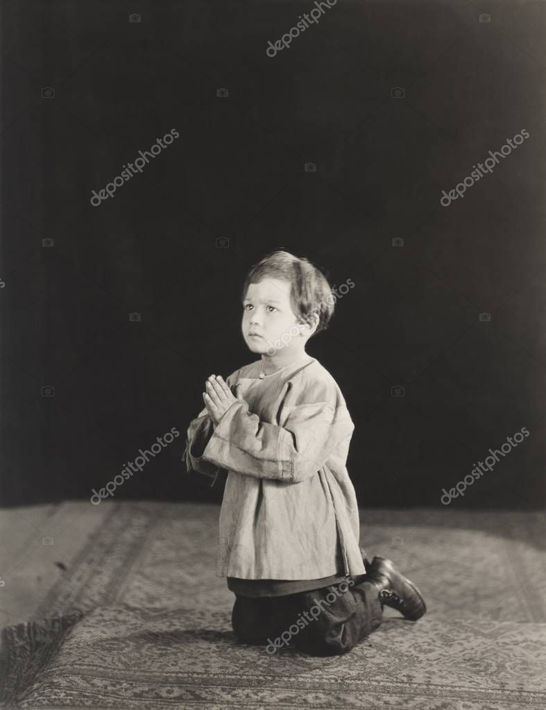 Boy kneeling on floor — Stock Photo © everett225 #130177044